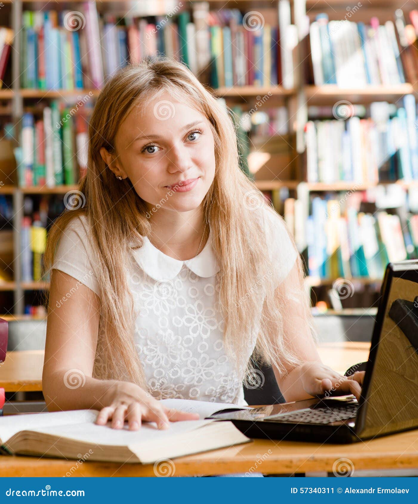 Happy Female Student with Laptop in Library Stock Image - Image of book ...