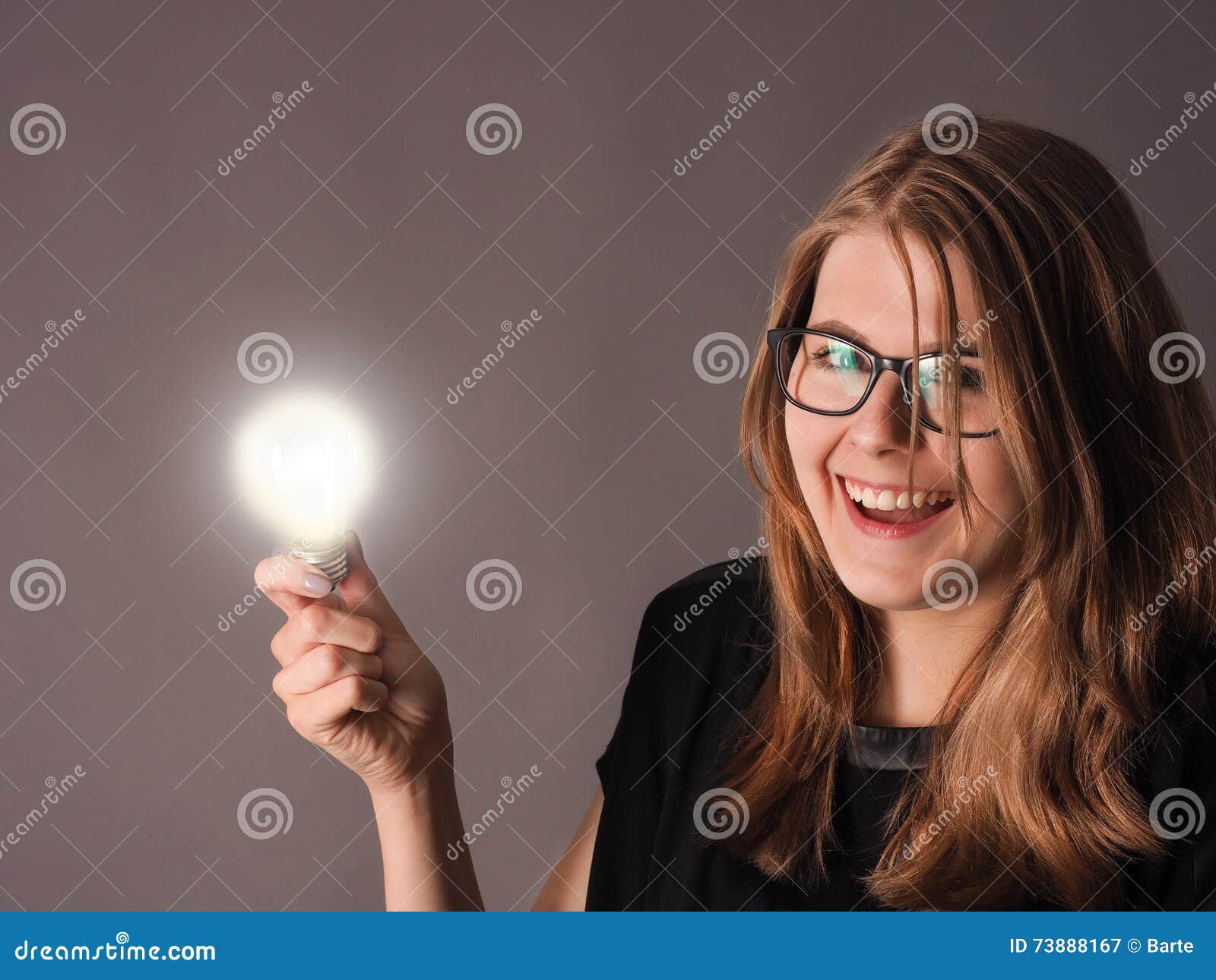 Happy Female Student with a Light Bulb Stock Image - Image of idea ...
