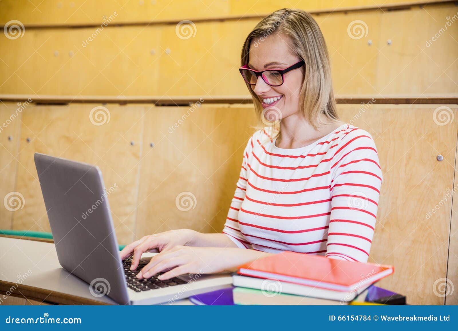 Happy Female Student Typing on Laptop Stock Photo - Image of ...