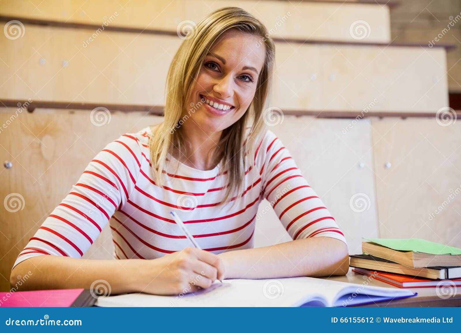 Happy Female Student Writing Notes Stock Photo - Image of book ...