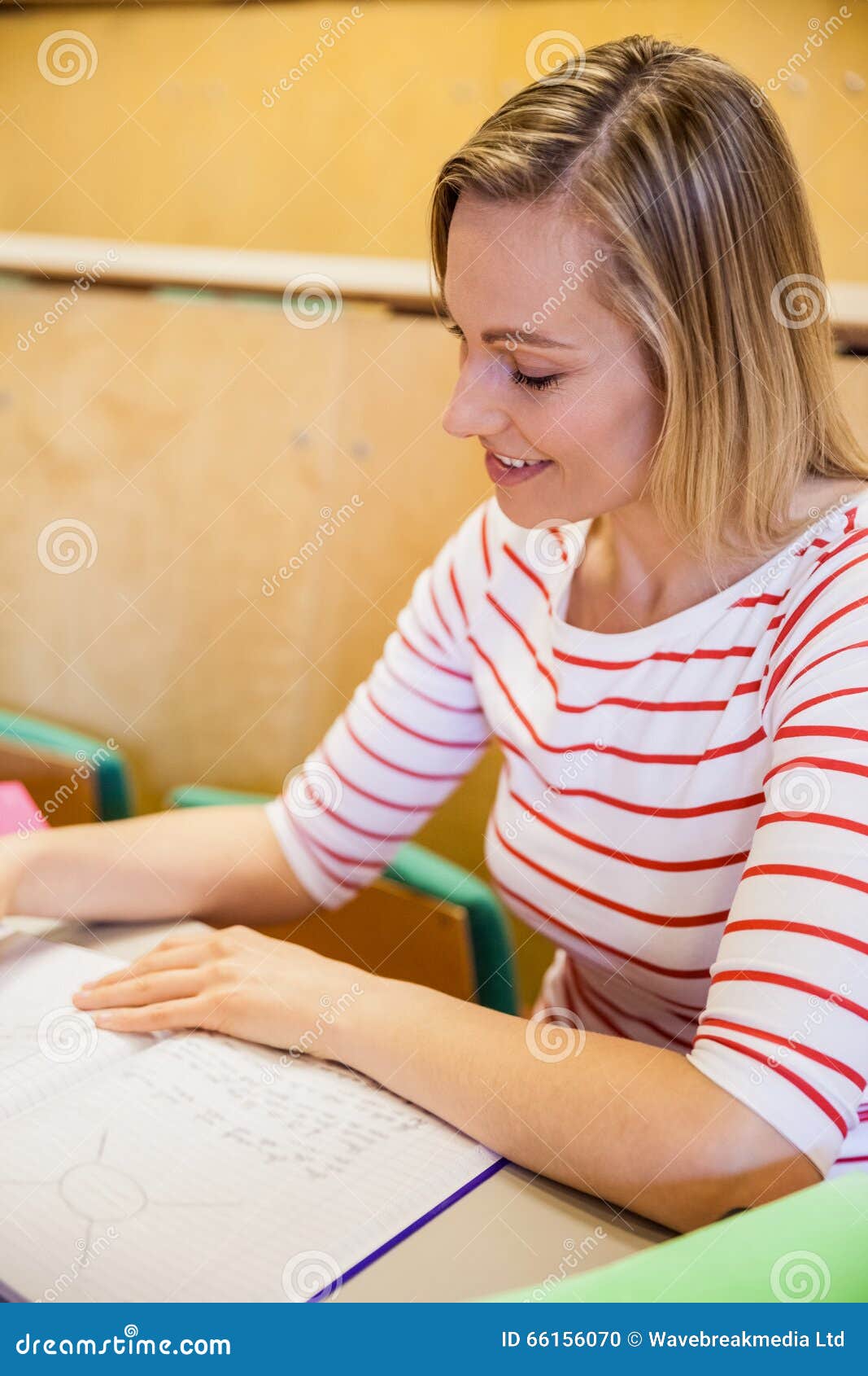 Happy Female Student Writing Notes Stock Photo - Image of classmates ...