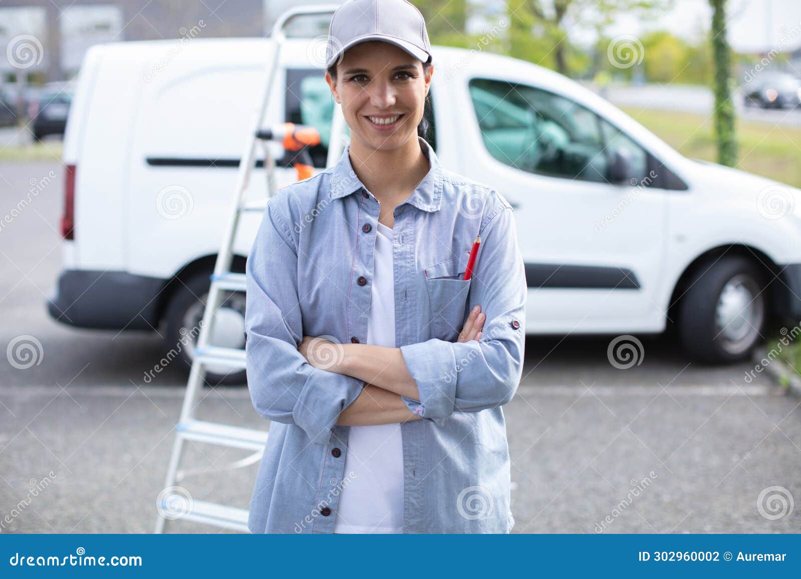 Happy Female Technician Next To Ladder Stock Photo - Image of young ...