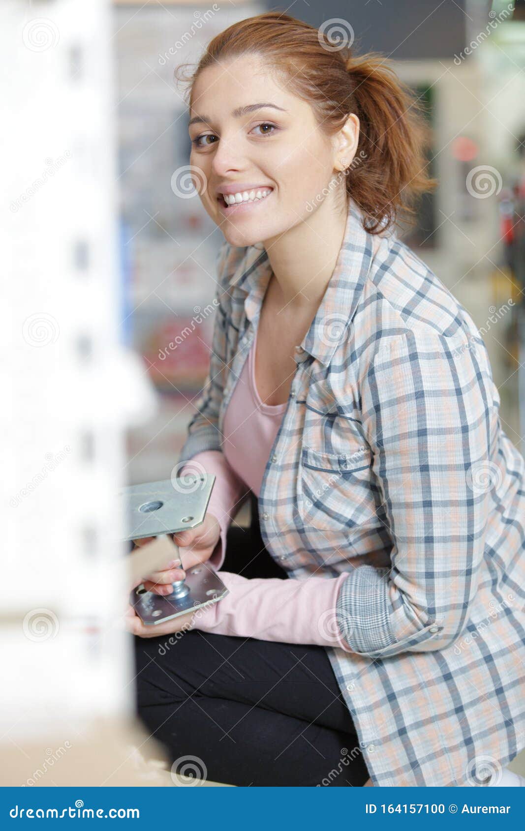 Happy Female Worker in Hardware Store Stock Photo - Image of casual ...