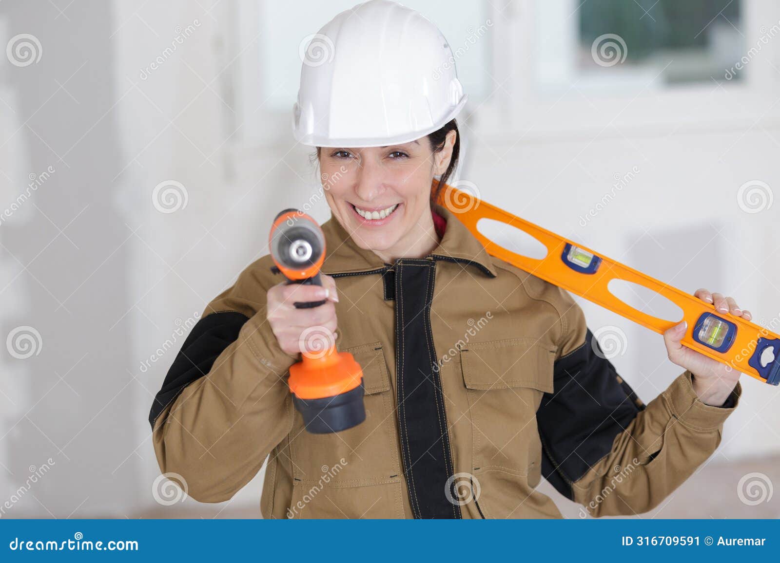 Happy Female Worker with Tool Level and Drill at Work Stock Image ...