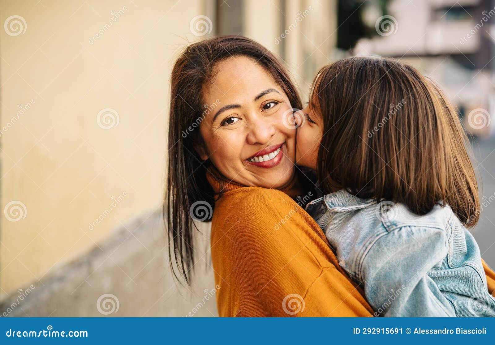 Happy Filipina Mother With Her Daughter Having Tender Moments In The