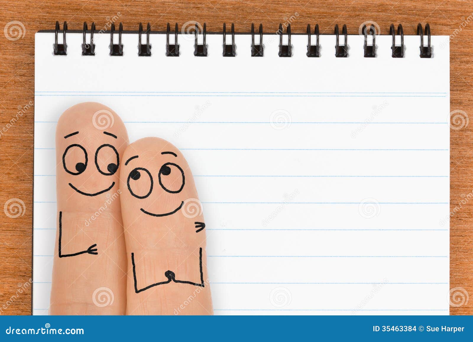 Happy Finger Face Couple with Blank Notepad Copy Space Stock Photo ...