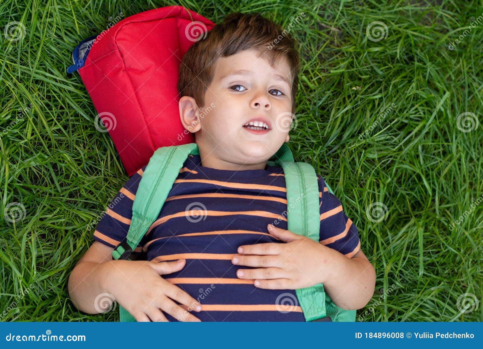Happy First Day of School. Adorable Schoolboy with Backpack, Lies on ...