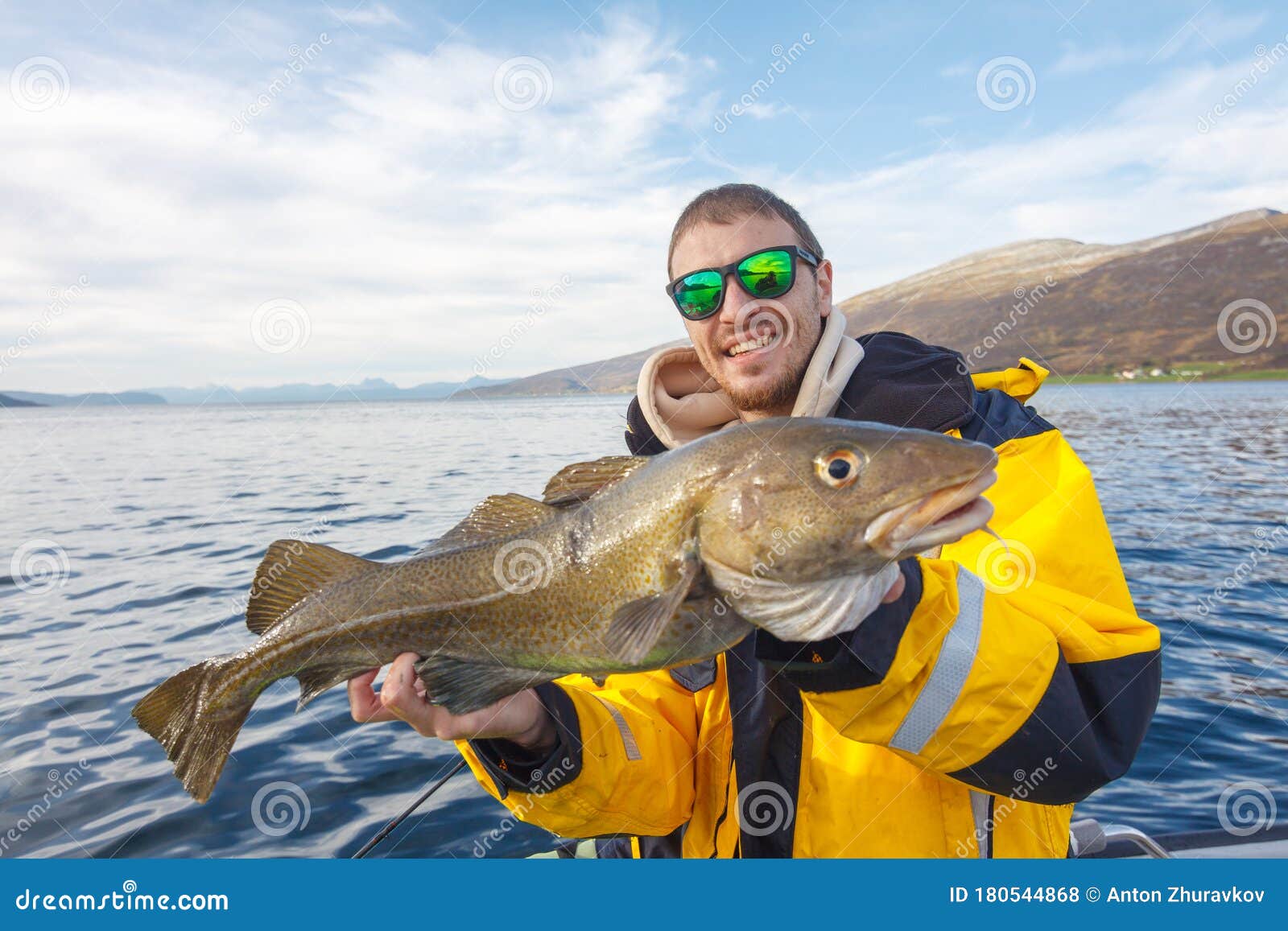 Happy Fisherman with Cod Fish in Hands Stock Photo - Image of hand ...