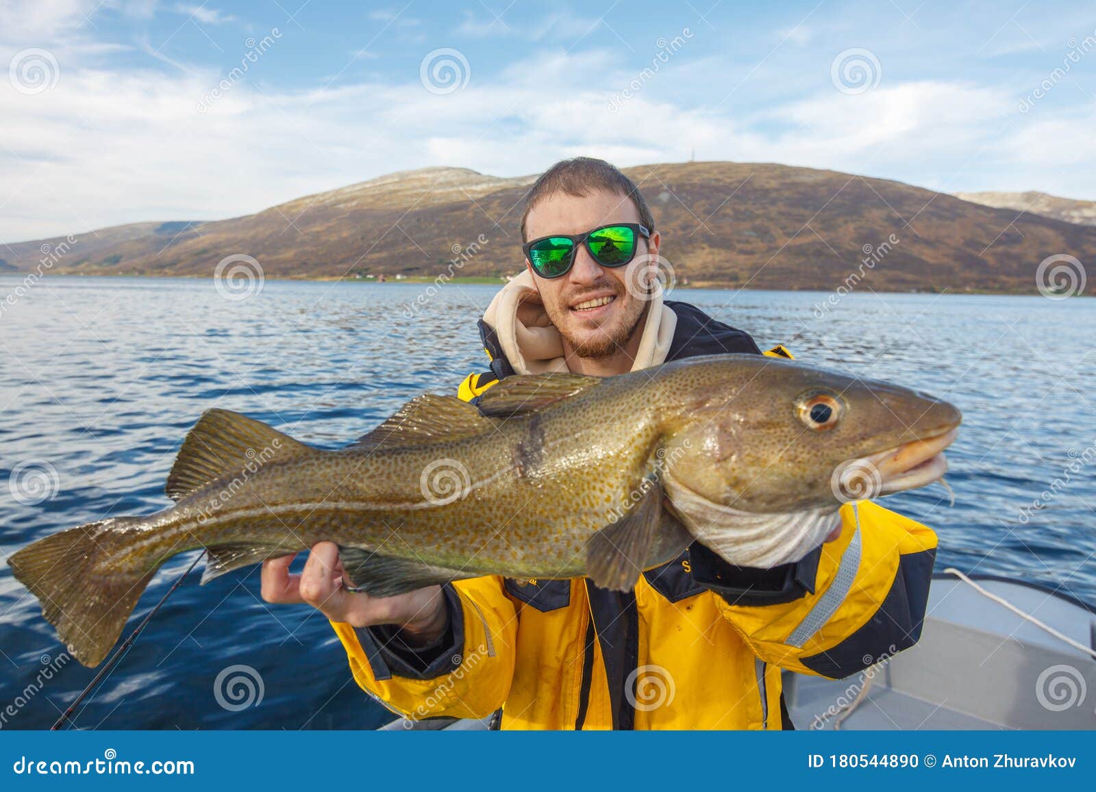 Happy Fisherman with Cod Fish in Hands Stock Photo - Image of angler ...