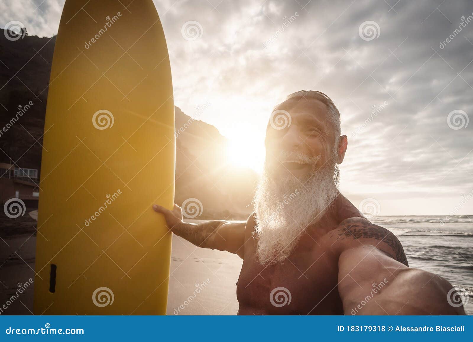 Happy Fit Senior Having Fun Surfing At Sunset Time Sporty Bearded Man