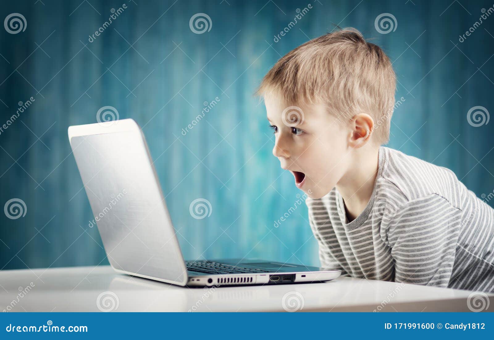 Happy Five Years Old Child Sitting with a Laptop at Table Stock Photo ...