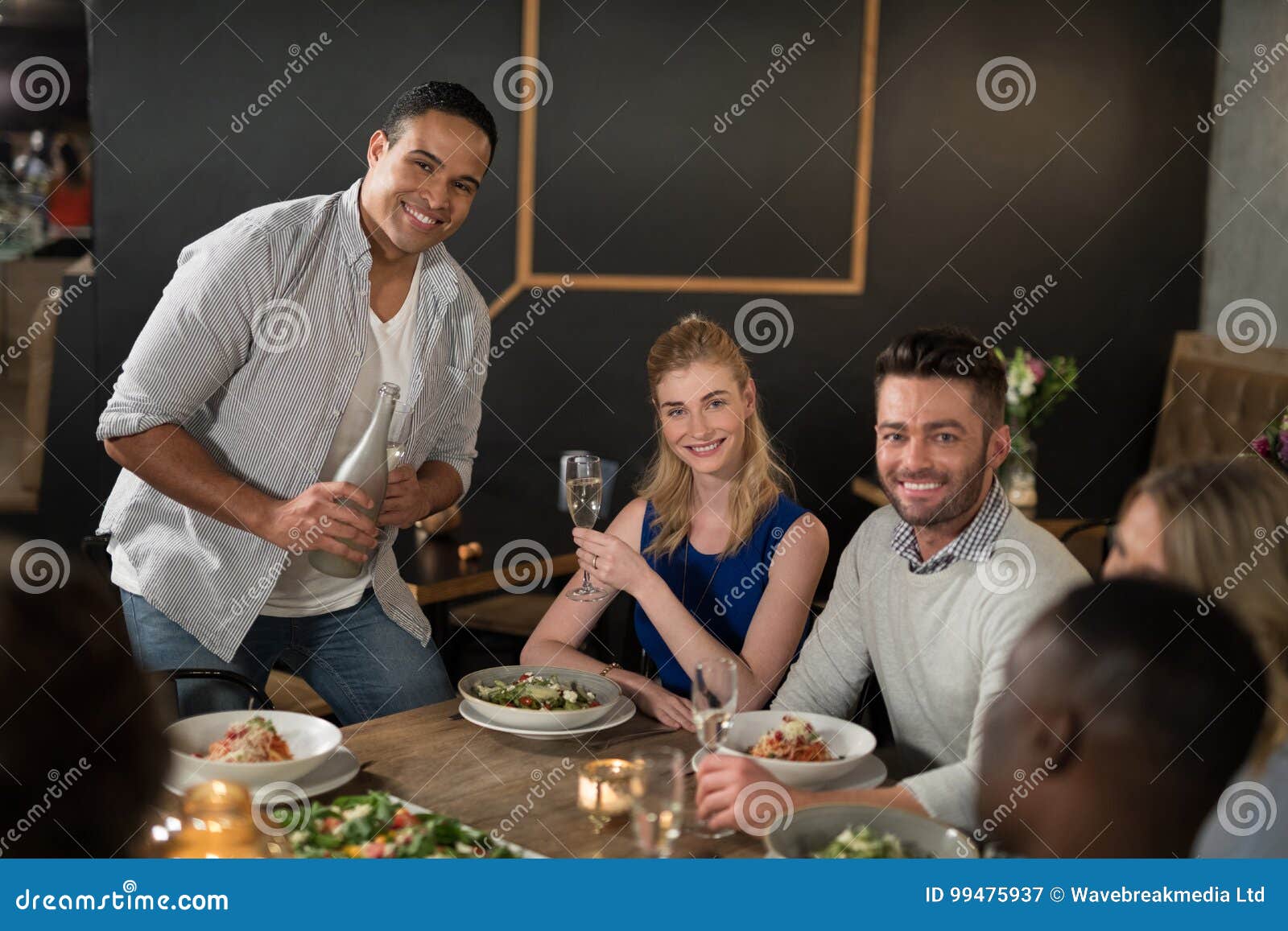 Happy Friends Dinging Together in Restaurant Stock Image - Image of ...