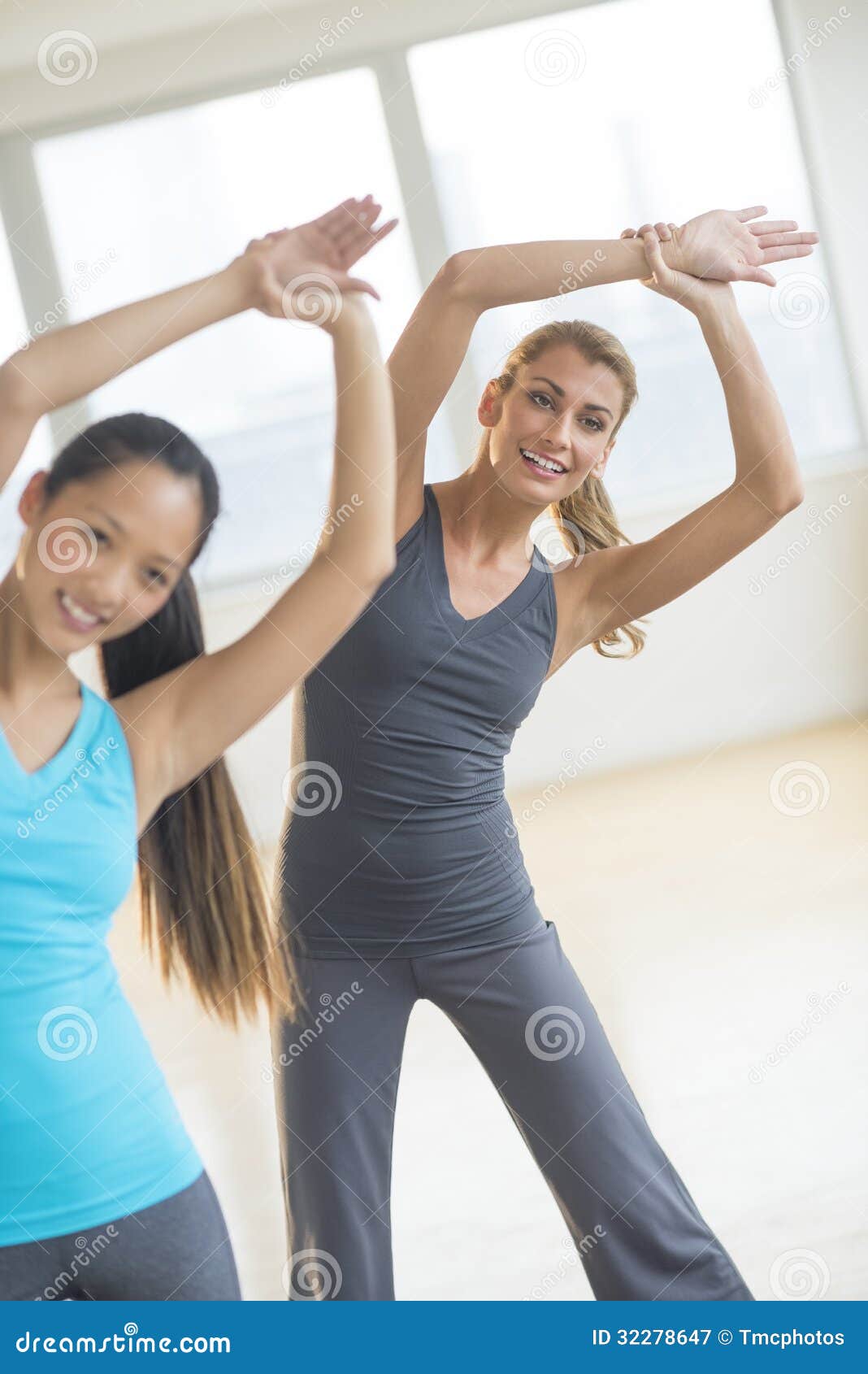 Happy Friends Doing Stretching Exercise at Gym Stock Image - Image of ...