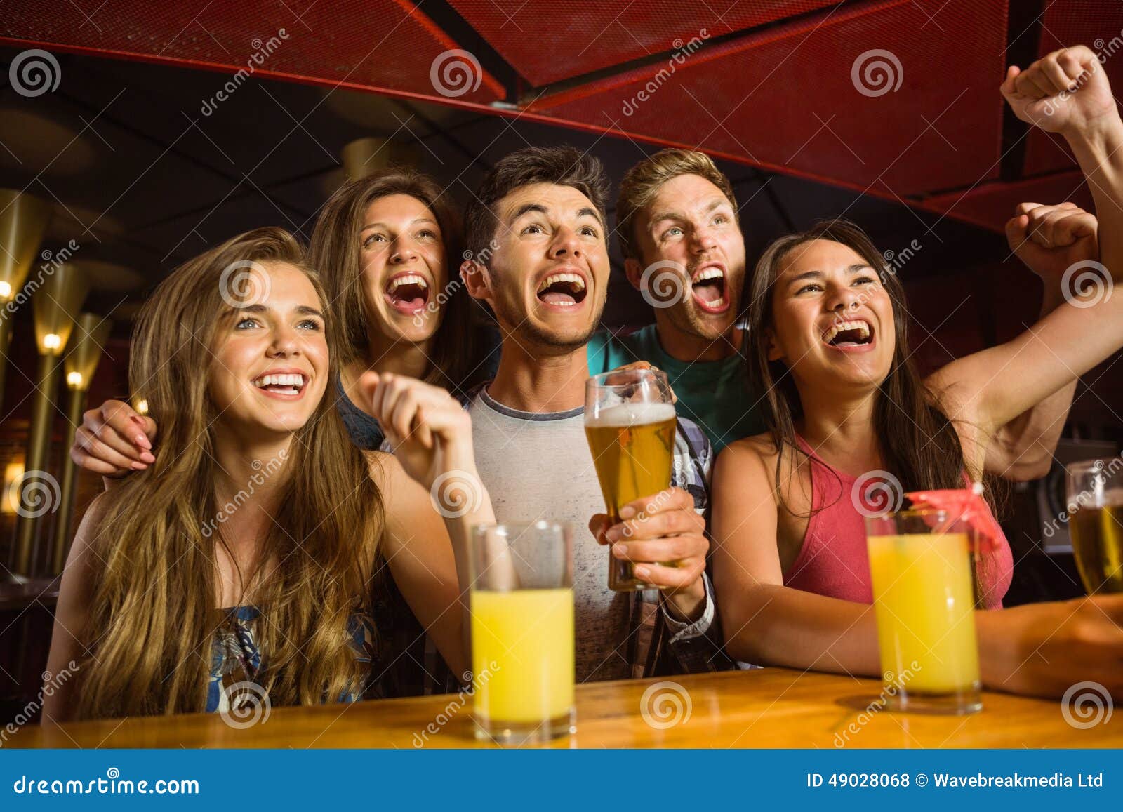 Happy Friends Drinking Beer and Cheering Together Stock Photo - Image ...