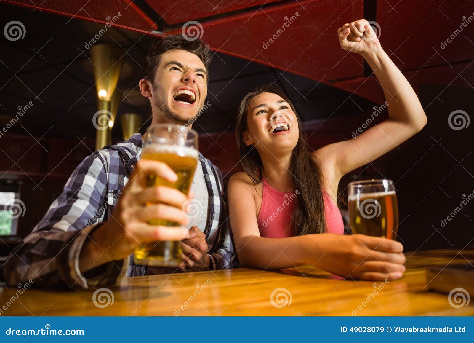 Happy Friends Drinking Beer and Cheering Together Stock Image - Image ...