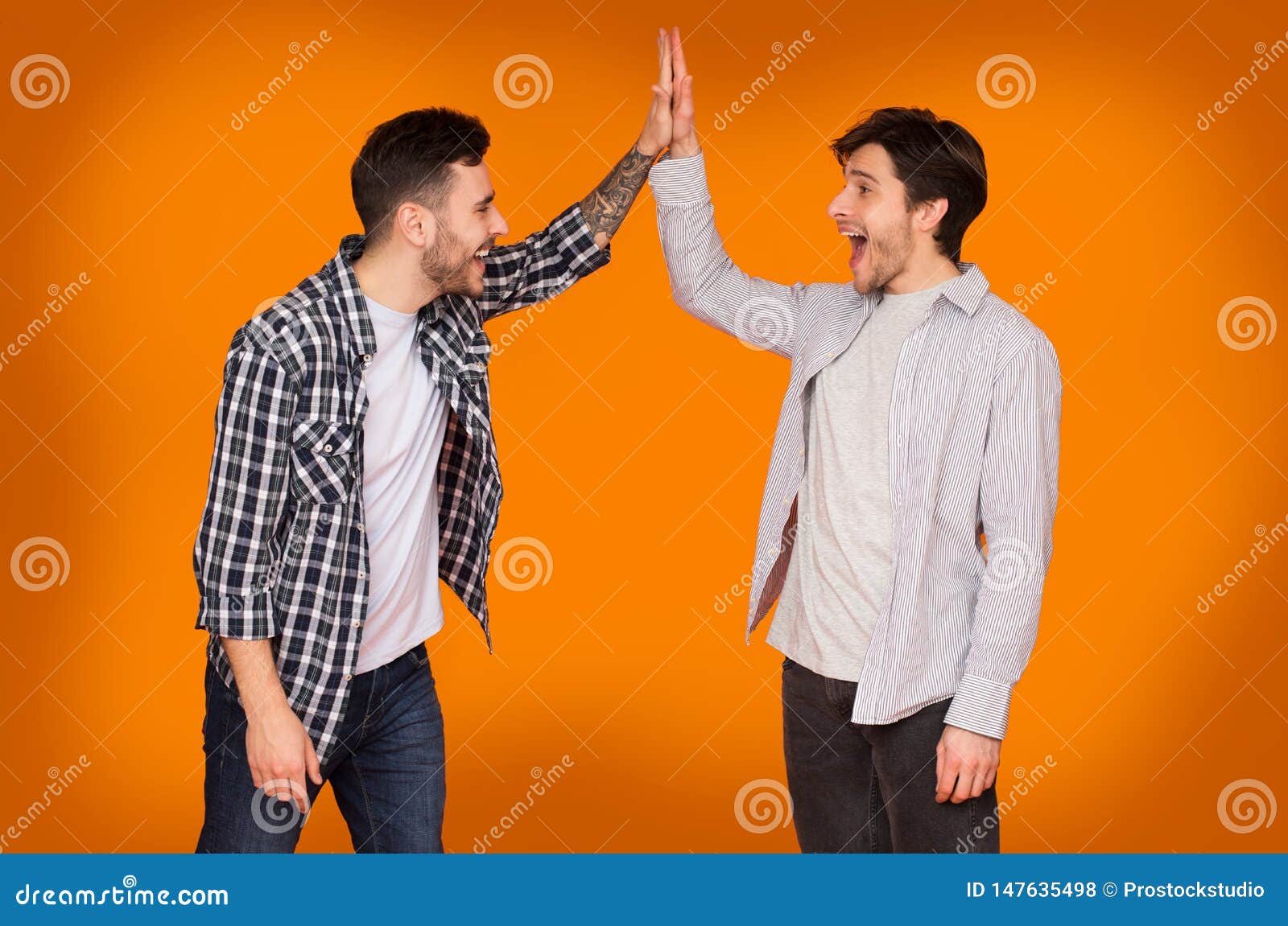 Happy Friends Giving High Five, Orange Background Stock Photo - Image ...