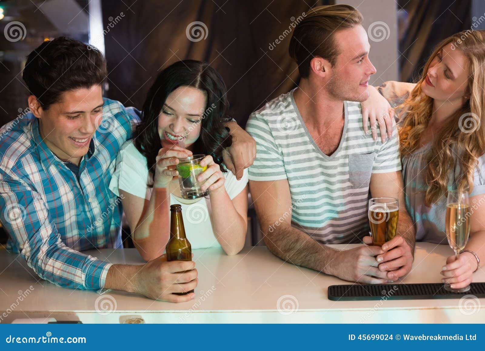Happy Friends Having a Drink Together Stock Photo - Image of looking ...