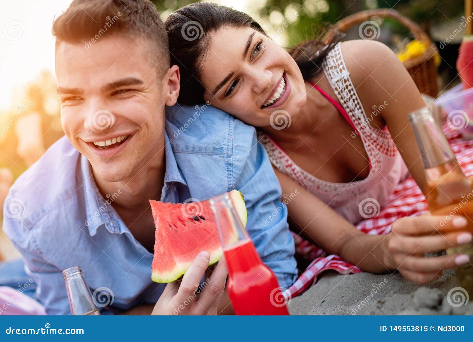 Happy Friends Having Fun on the Beach and Eating Watermelon. Stock ...