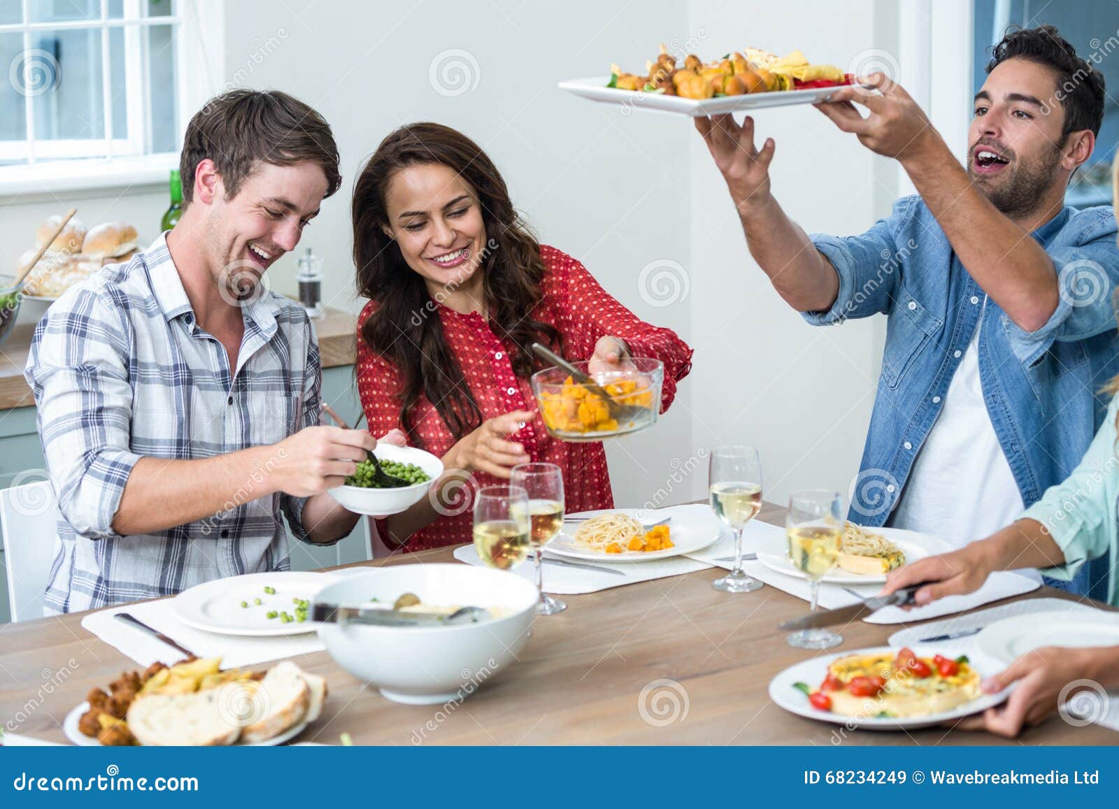 Happy friends having lunch stock image. Image of affection - 68234249