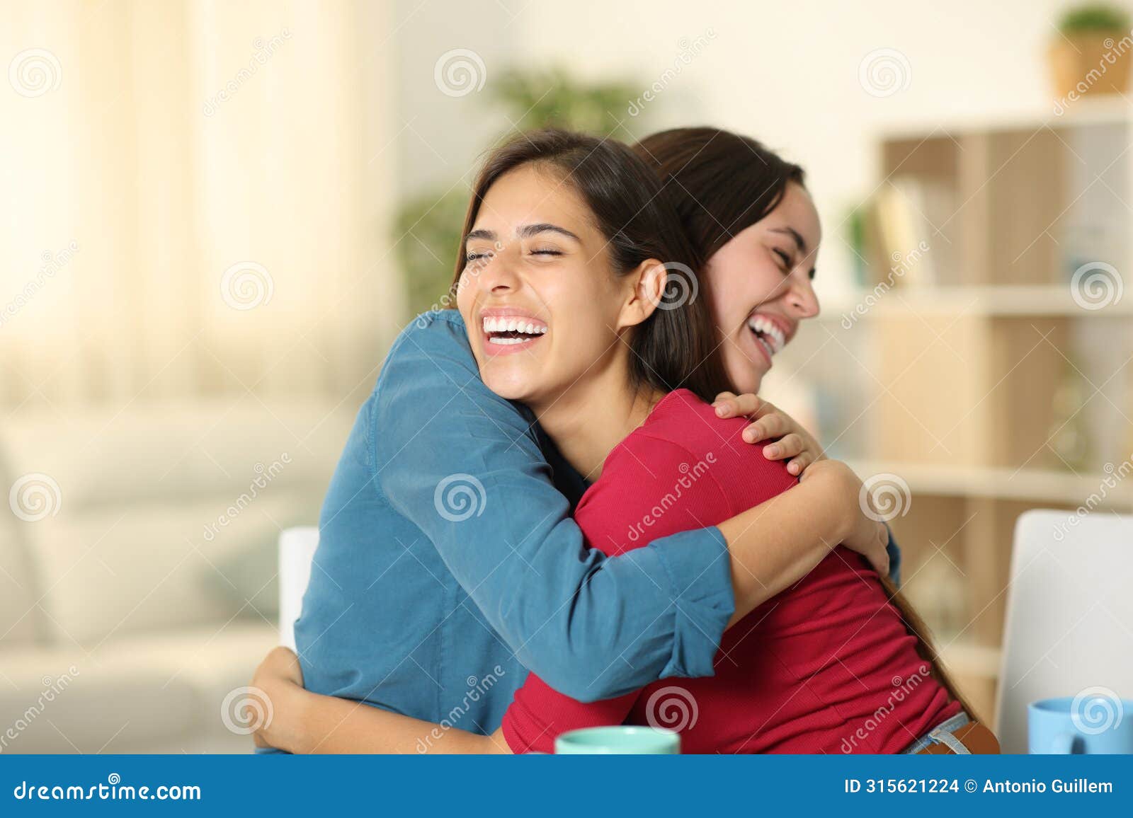 Happy Friends are Hugging at Home Stock Photo - Image of thrill, friend ...