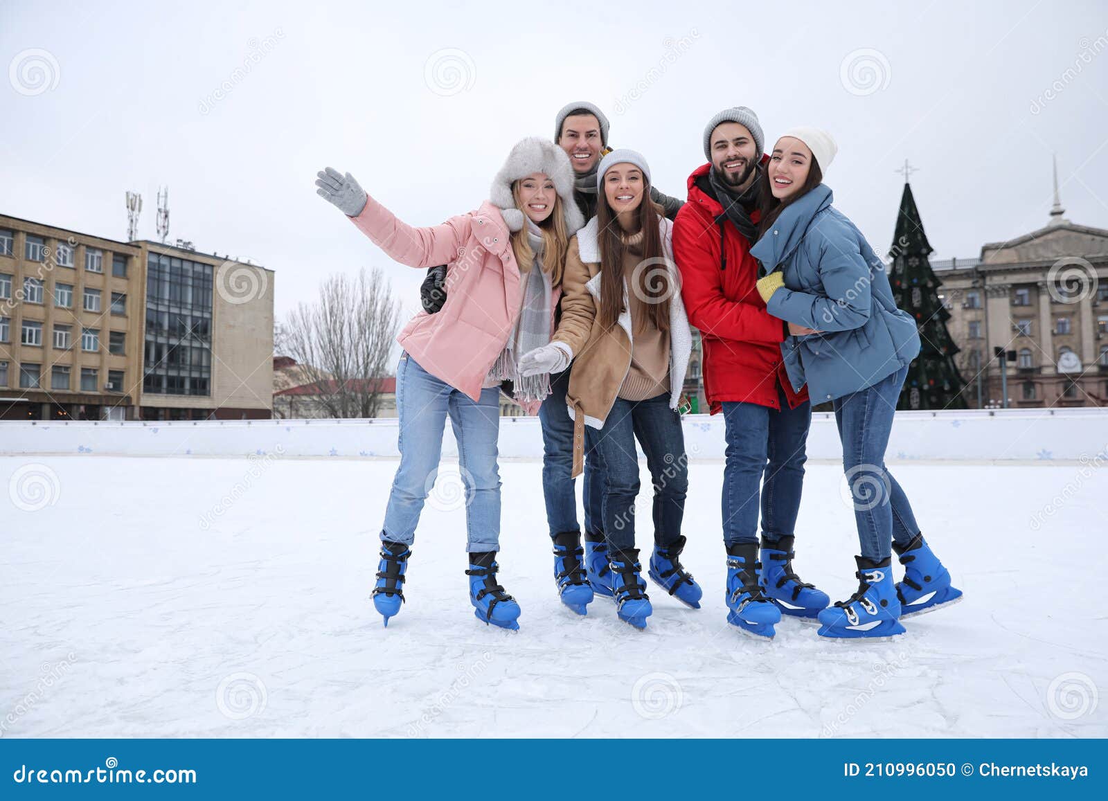 Happy Friends at Ice Skating Rink Outdoors Stock Photo - Image of ...