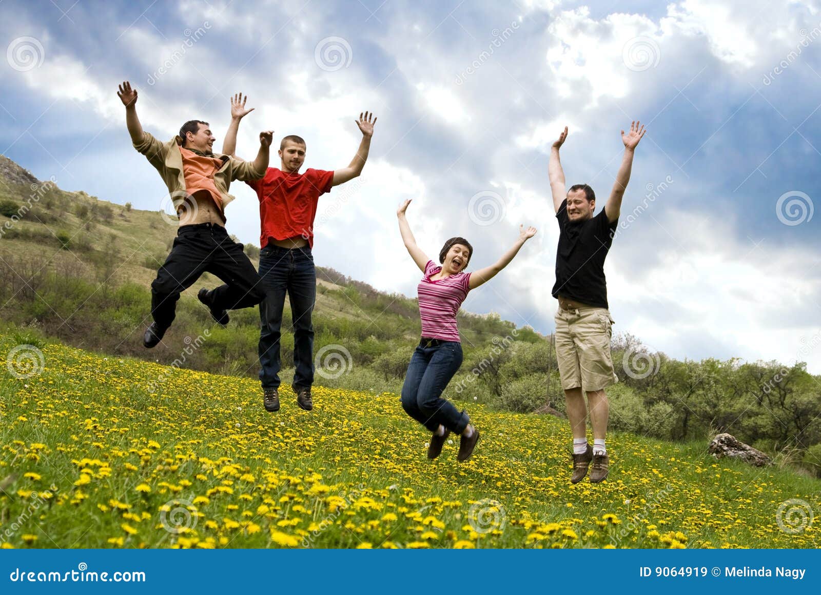 Happy Friends Jumping in Meadow Stock Image - Image of dynamic ...
