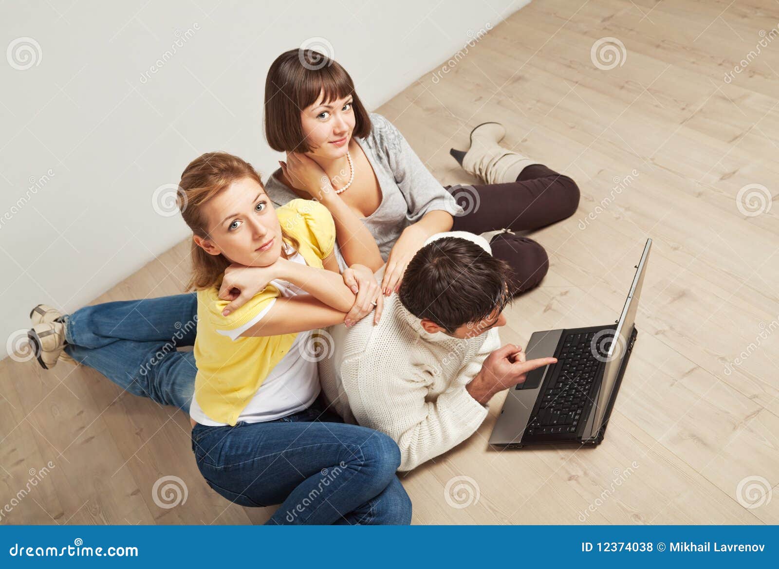 Happy Friends with Laptop Computer Stock Photo - Image of young, floor ...