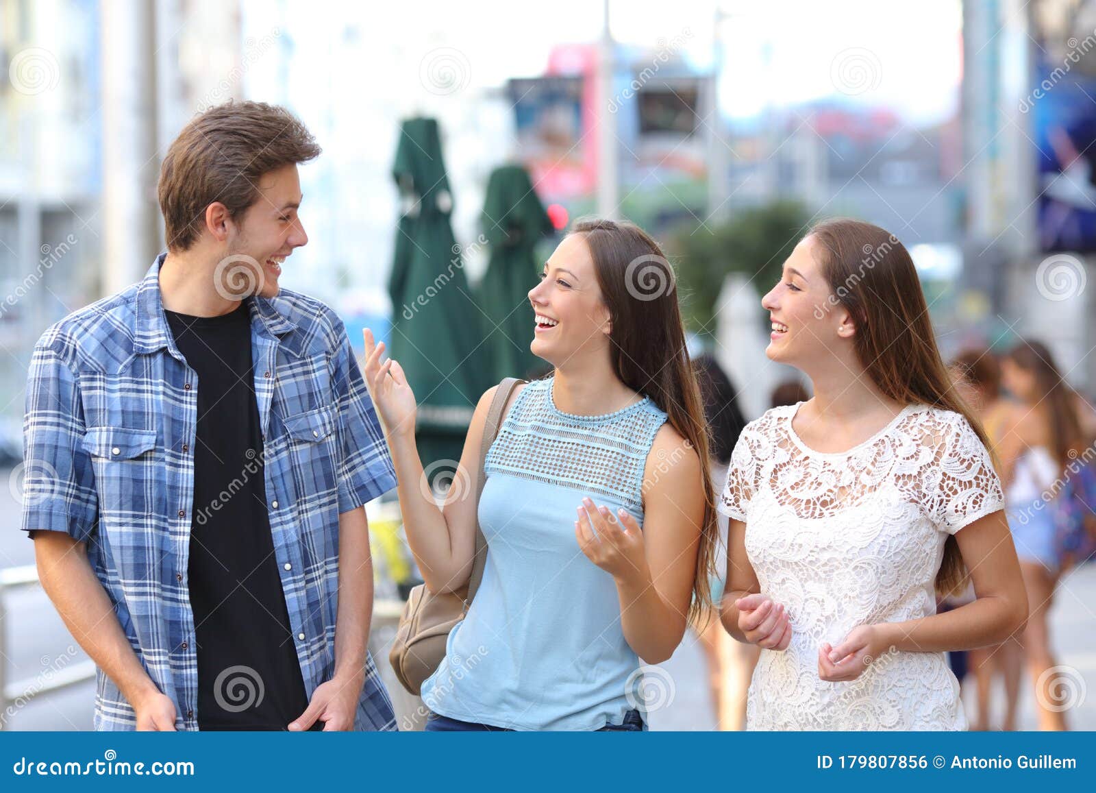 Happy Friends Laughing and Talking in the Street Stock Photo - Image of ...