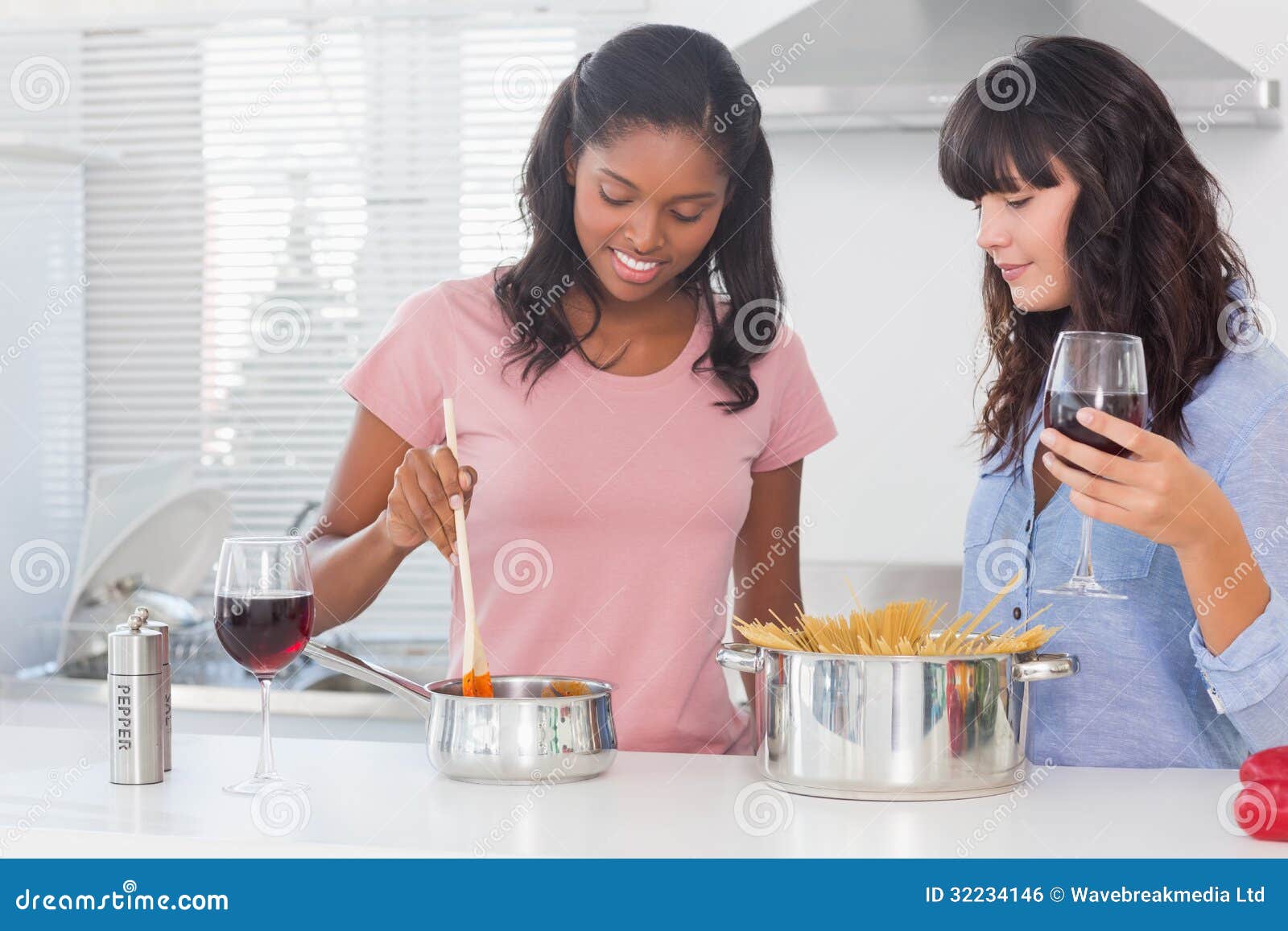 Happy Friends Making Dinner Together Stock Photo - Image of cooking ...