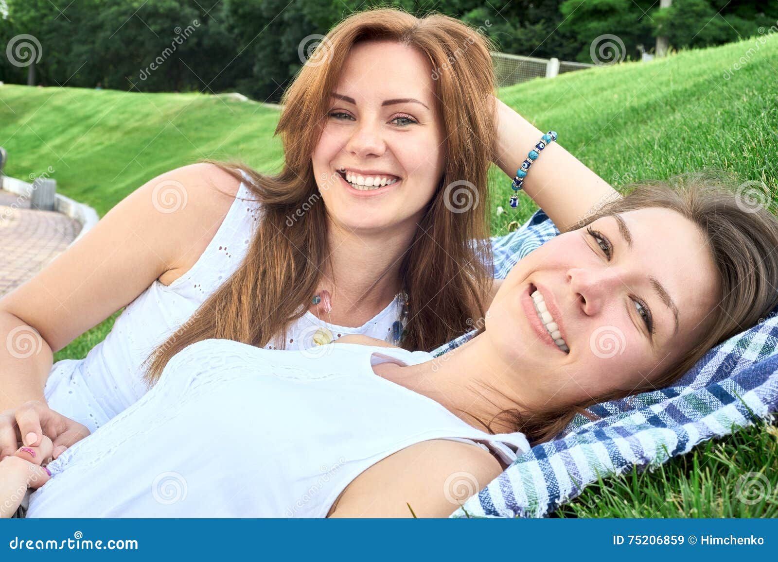 Happy friends in the park stock image. Image of attractive - 75206859