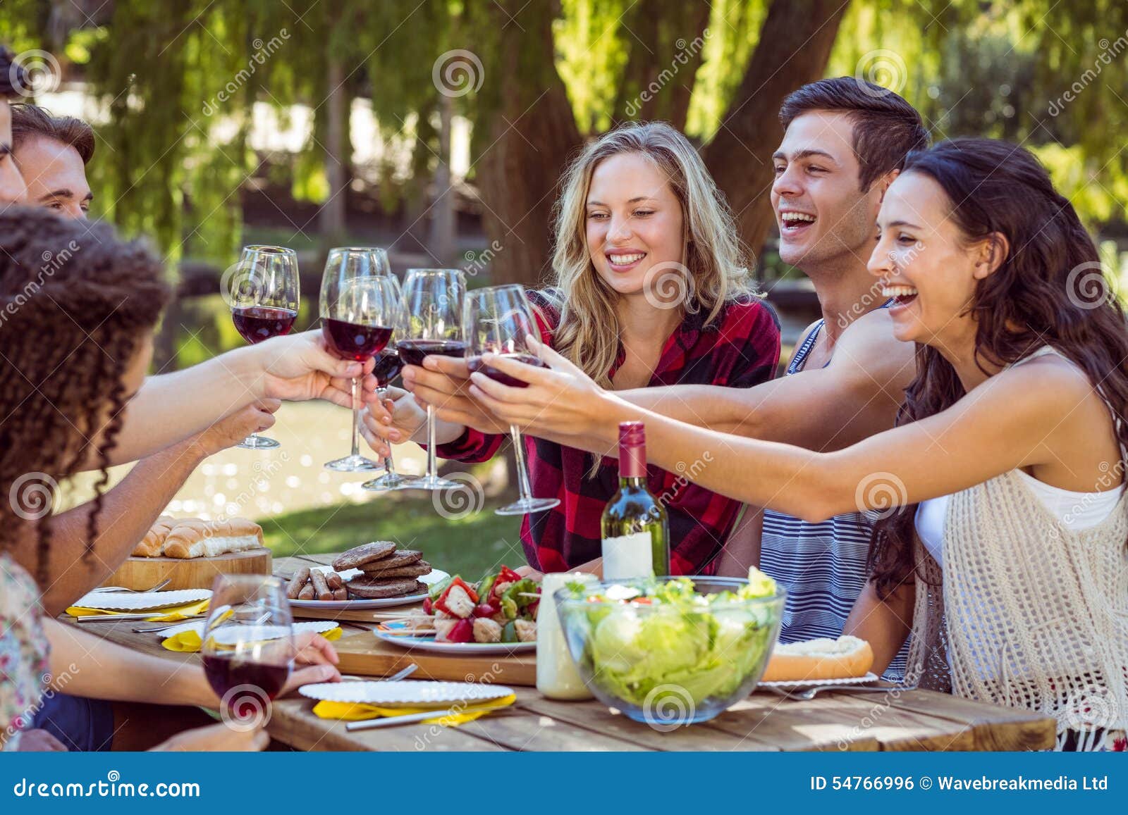 Happy Friends in the Park Having Lunch Stock Photo - Image of hispanic ...