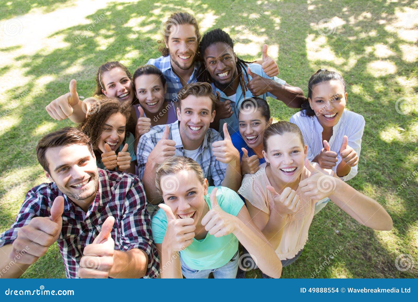 Happy friends in the park stock photo. Image of casual - 49888554