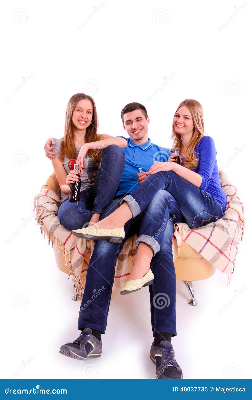 Happy Friends Sitting on a Sofa and Drinking Coca Cola Stock Image ...
