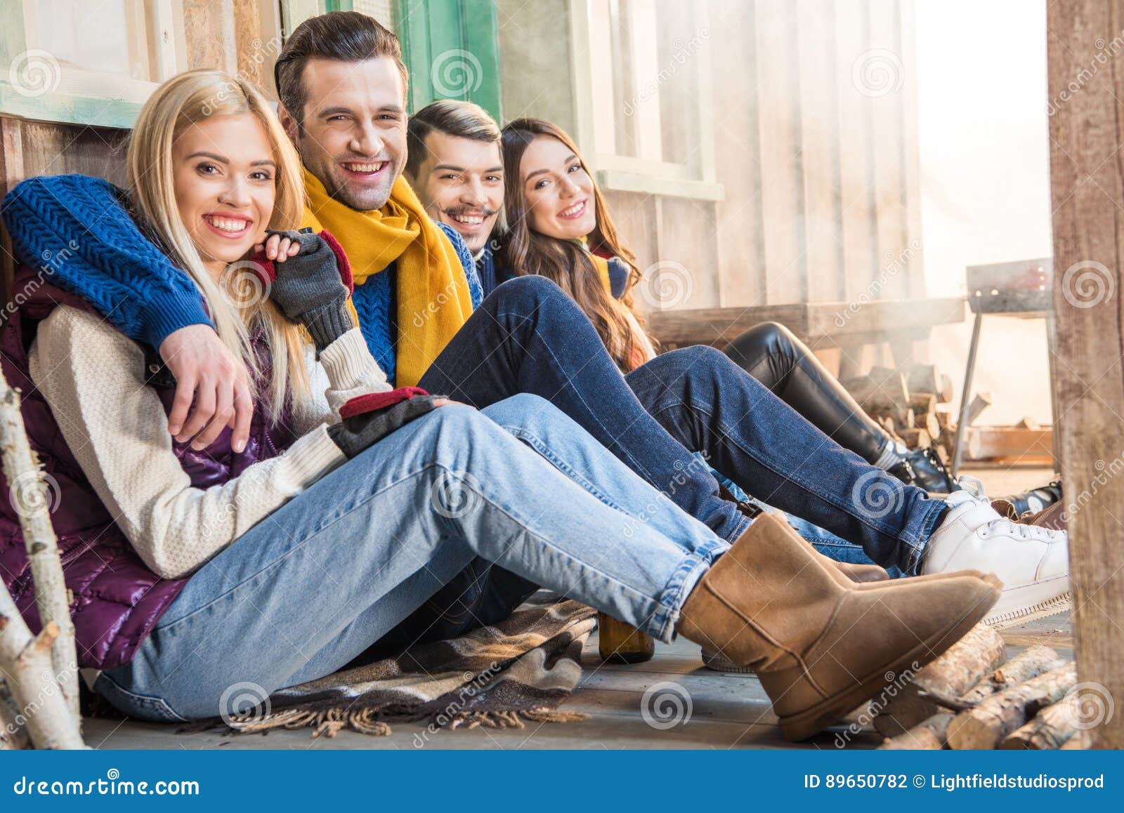 Happy Friends Sitting Together and Looking To Camera Stock Photo ...