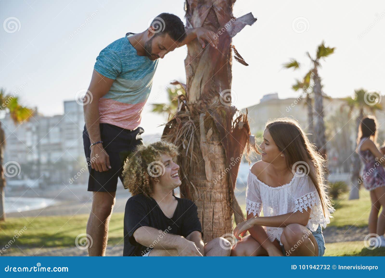 Happy Friends Sitting Under the Tree Talking Stock Photo - Image of ...