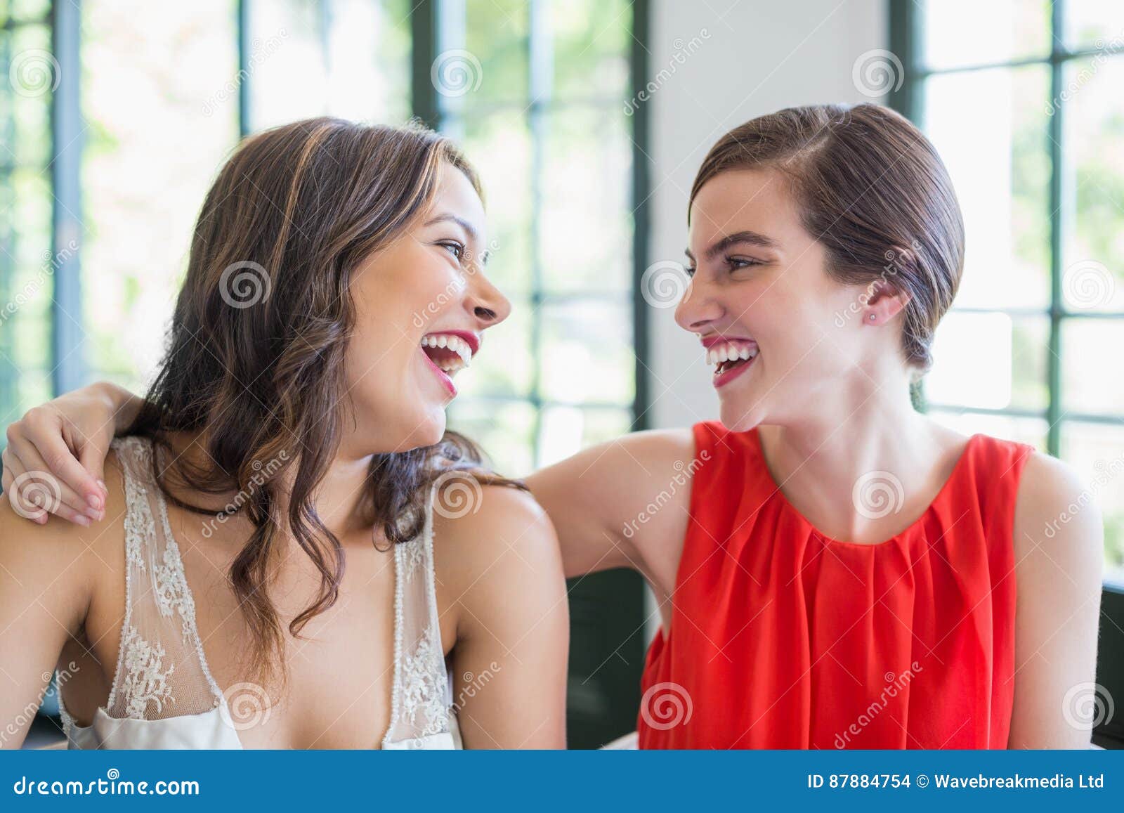 Happy Friends Smiling while Looking at Each Other Stock Photo - Image ...