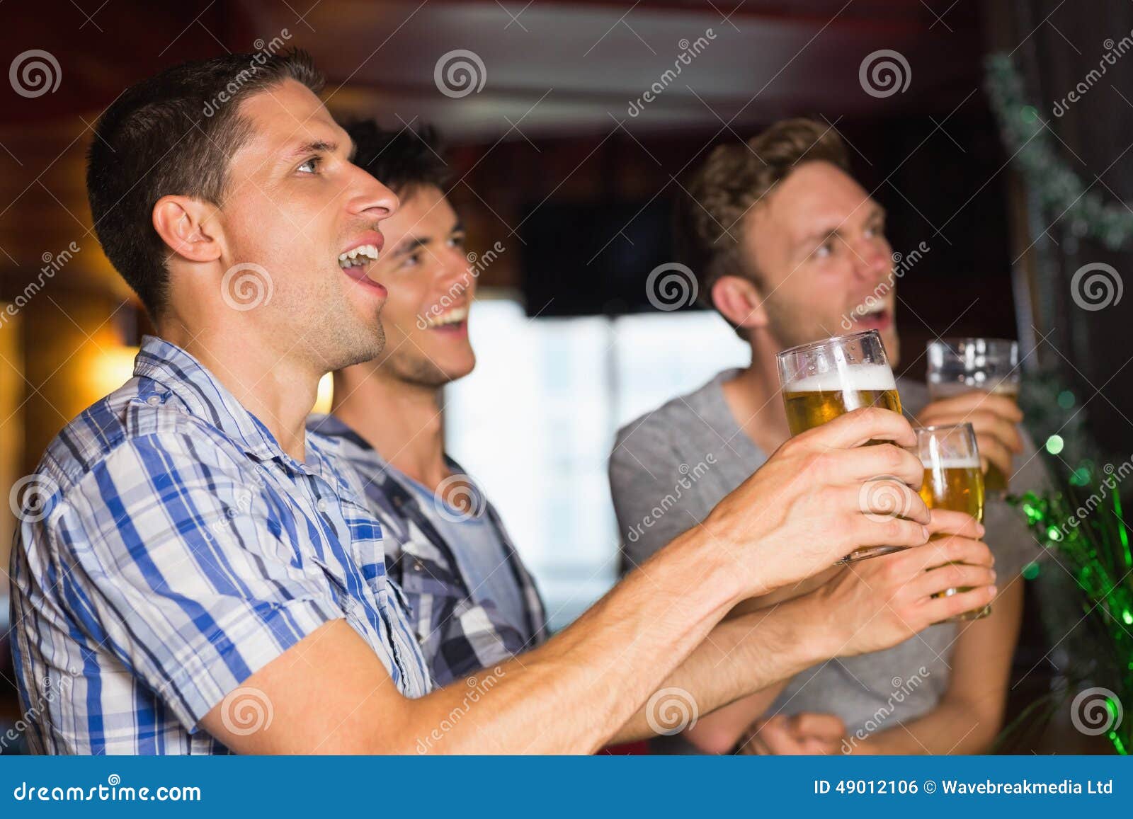 Happy Friends Toasting with Pints of Beer on Patricks Day Stock Photo ...