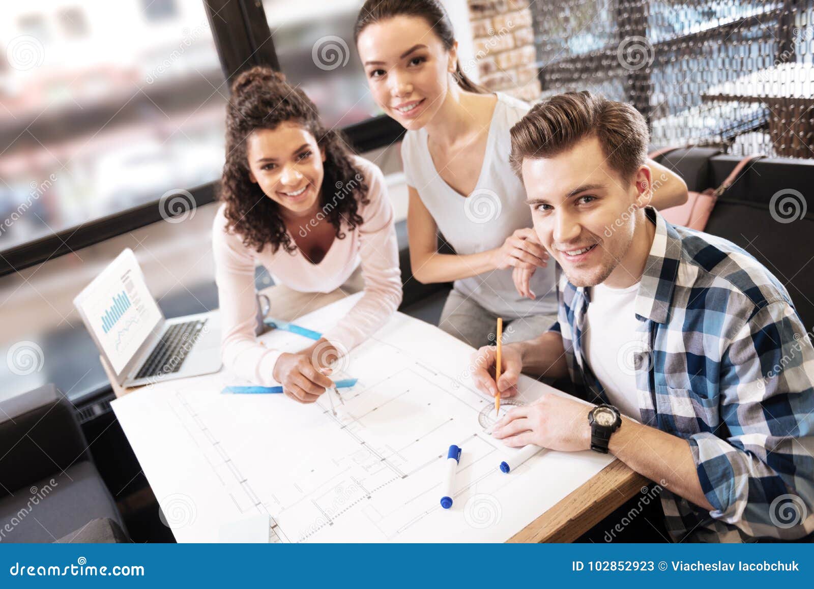 Happy Friends Working and Making a Technical Drawing Stock Image ...