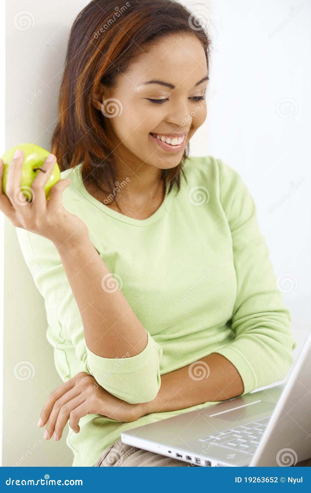 Happy Girl with Apple and Laptop Stock Photo - Image of happiness ...