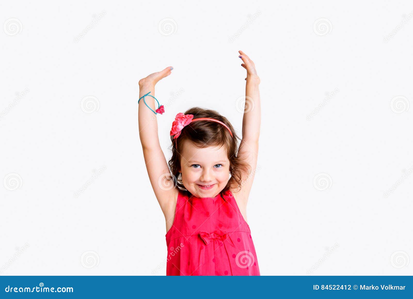 Happy girl with arms up stock photo. Image of childhood - 84522412