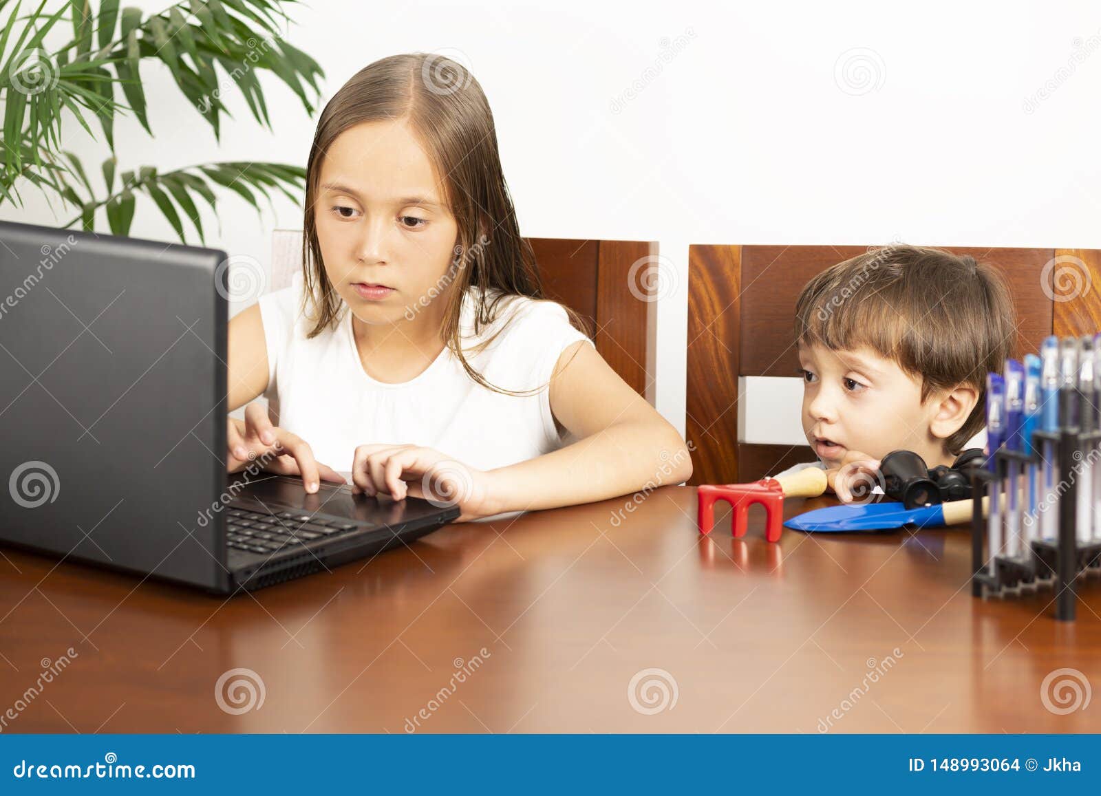 Happy Girl and Boy Using Laptop Stock Photo - Image of ideas, kids ...