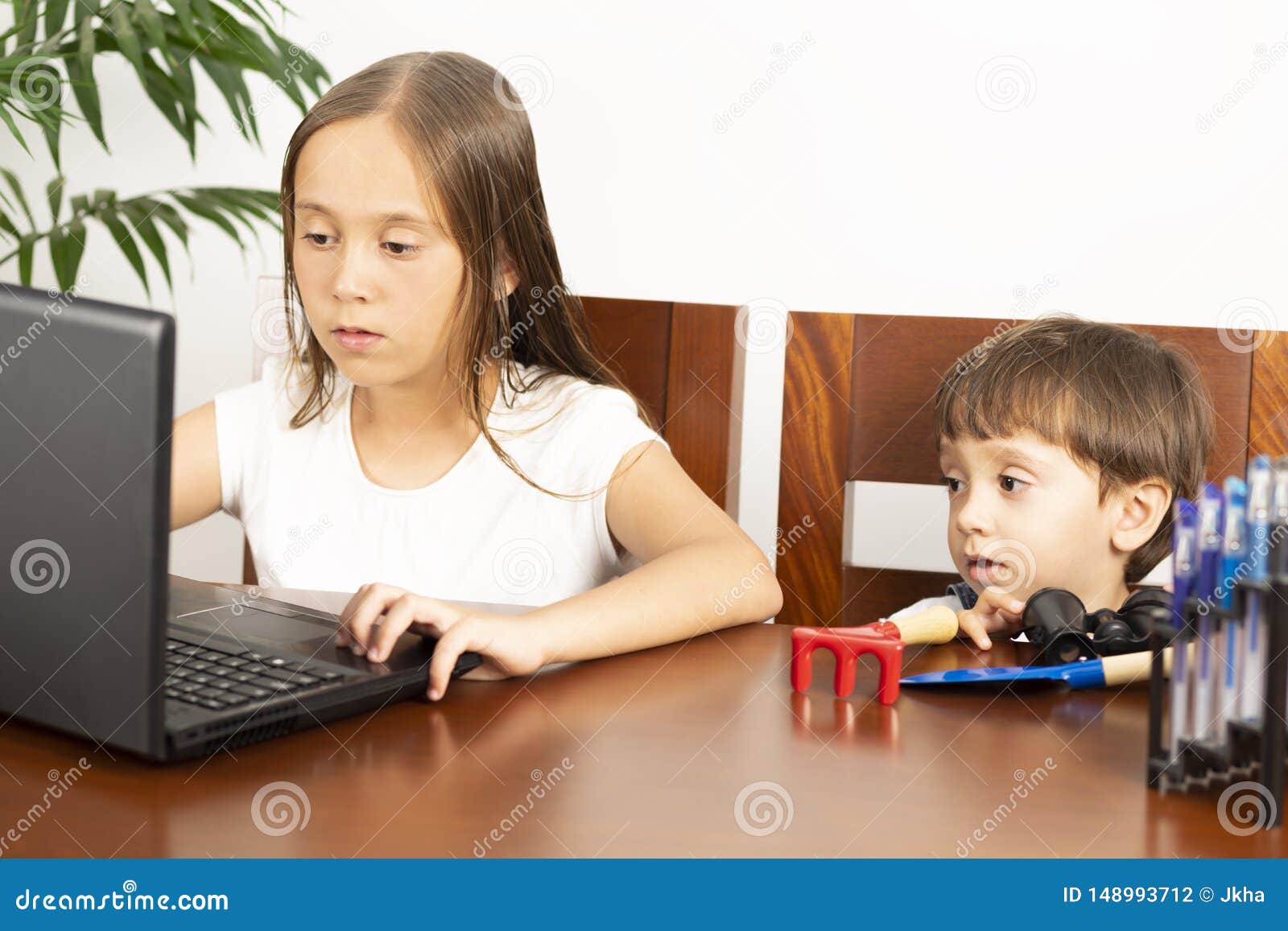 Happy Girl and Boy Using Laptop Stock Photo - Image of european ...