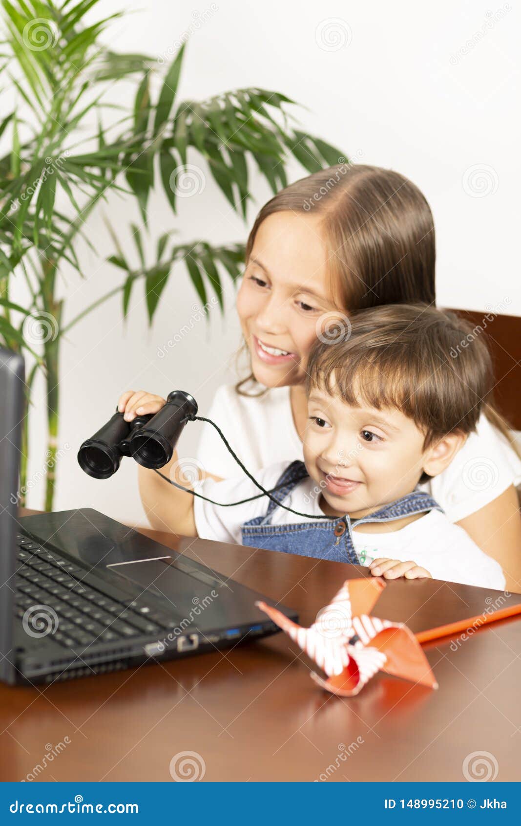 Happy Girl and Boy Using Laptop Stock Photo - Image of latin, game ...