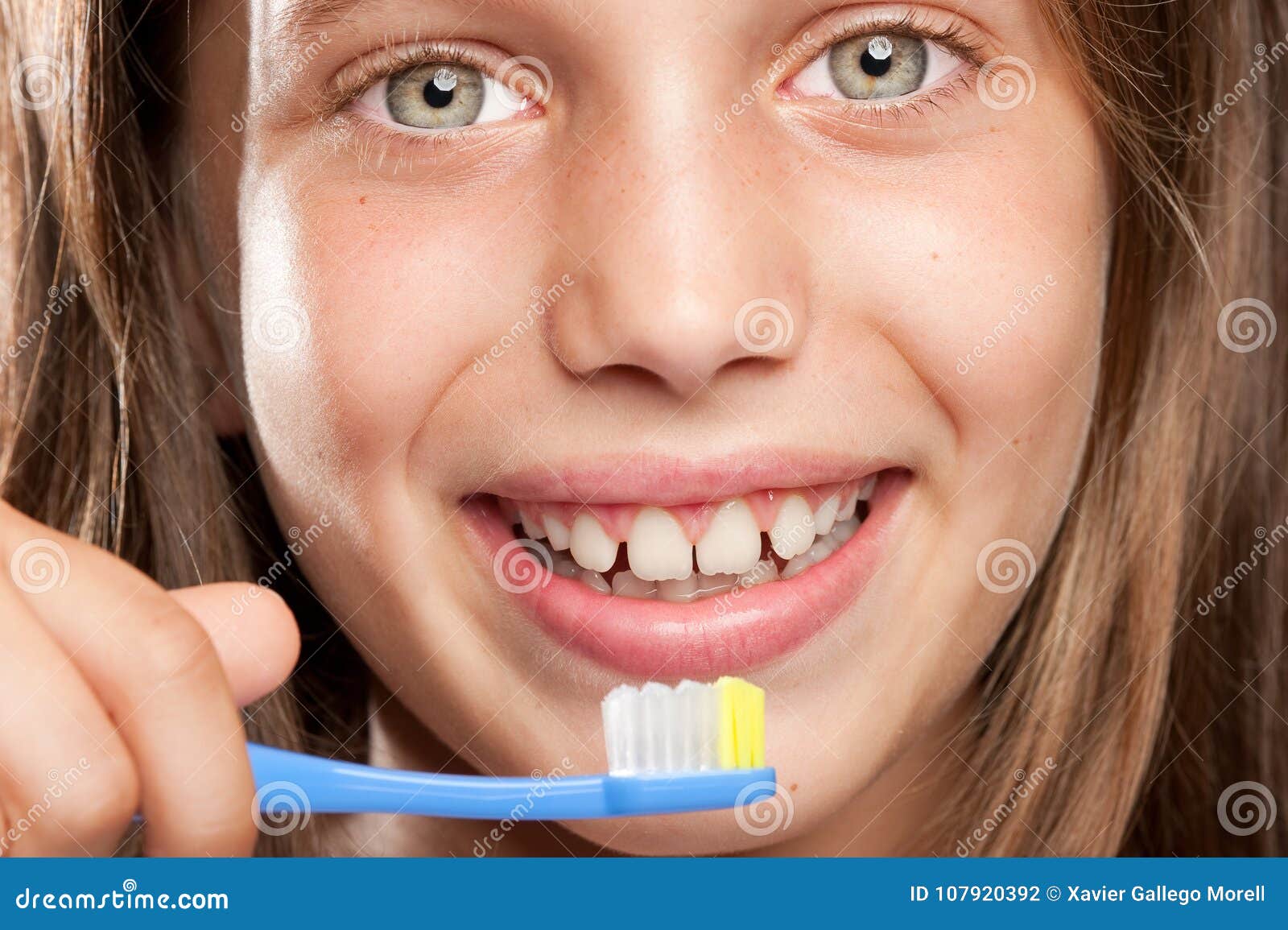 Girl brushing her teeth stock photo. Image of girl, lovely - 107920392
