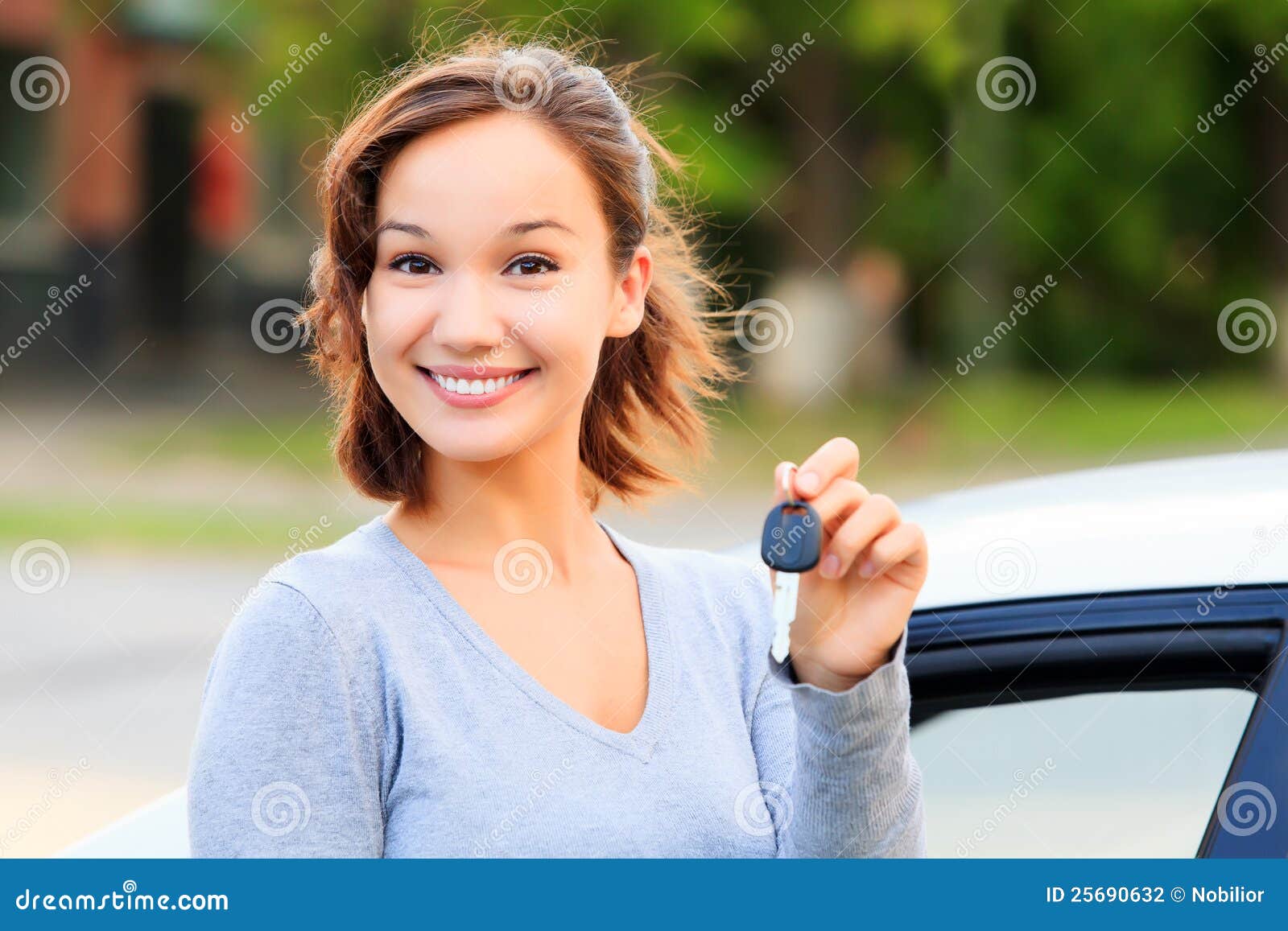 Happy girl with a car key stock photo. Image of portrait - 25690632