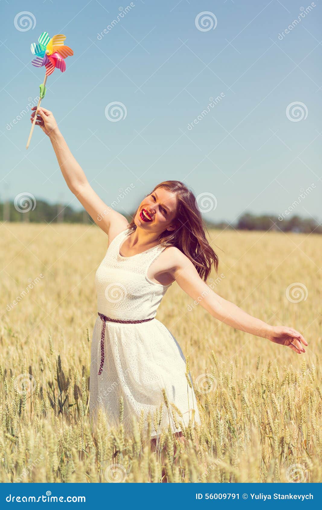 Happy Girl with a Colorful Windmill Stock Image - Image of sunlight ...