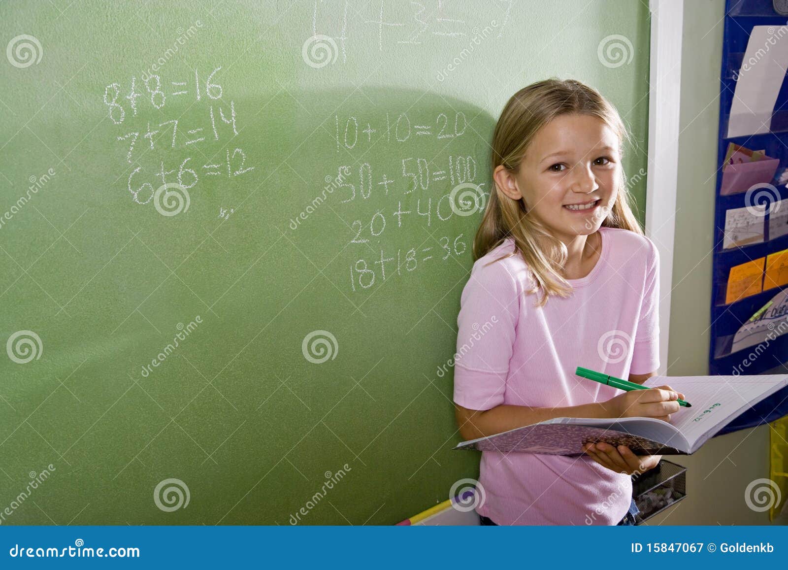 Happy Girl Doing Math On Blackboard In Class Stock Image - Image: 15847067