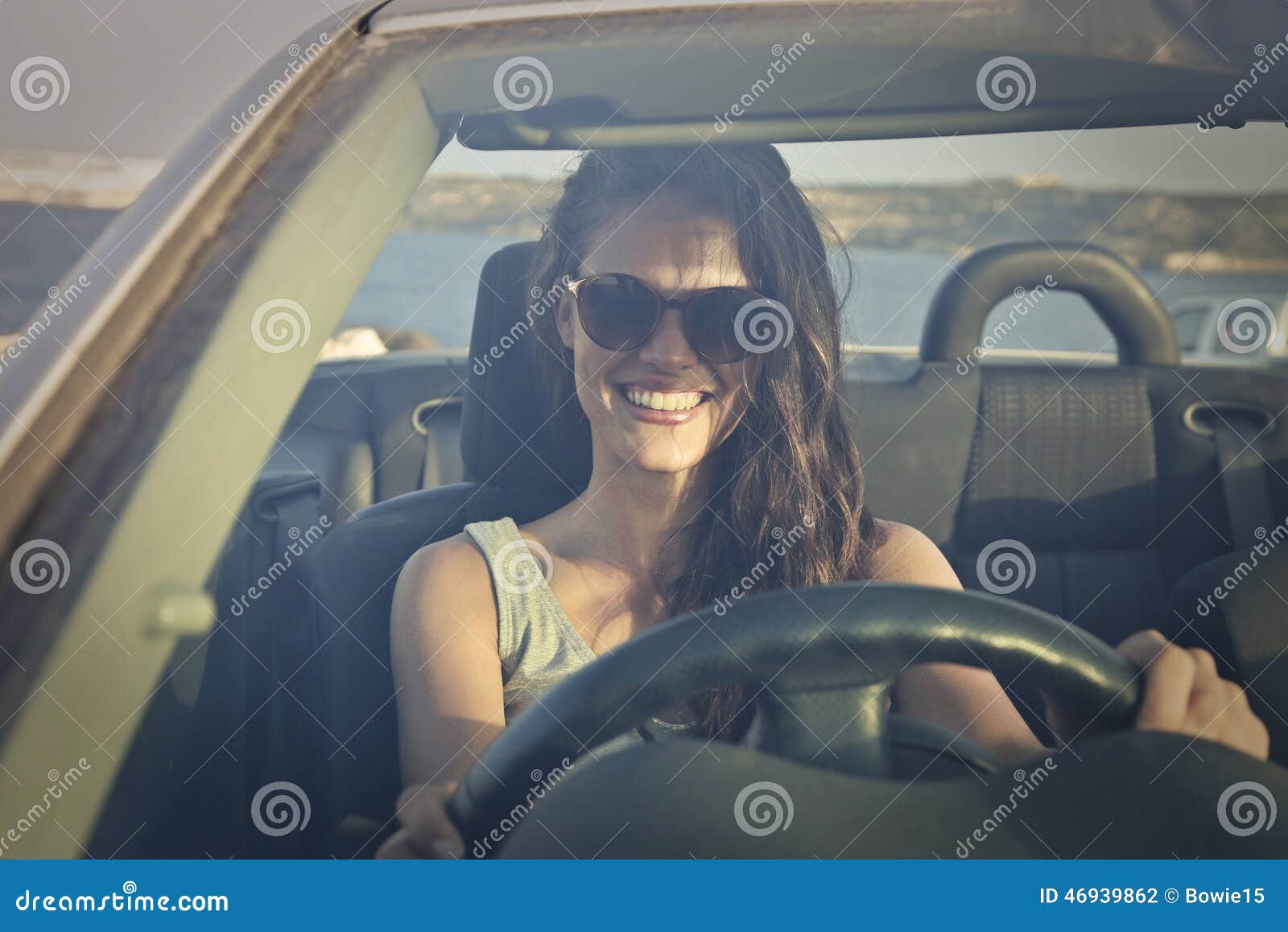 Happy girl driving a car stock photo. Image of driving - 46939862