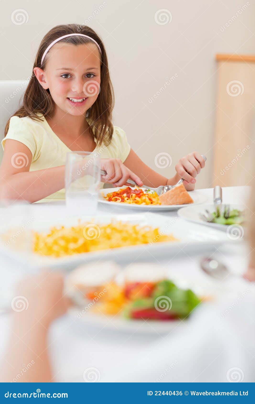 Happy Girl Having Dinner at Dinner Table Stock Photo - Image of salad ...