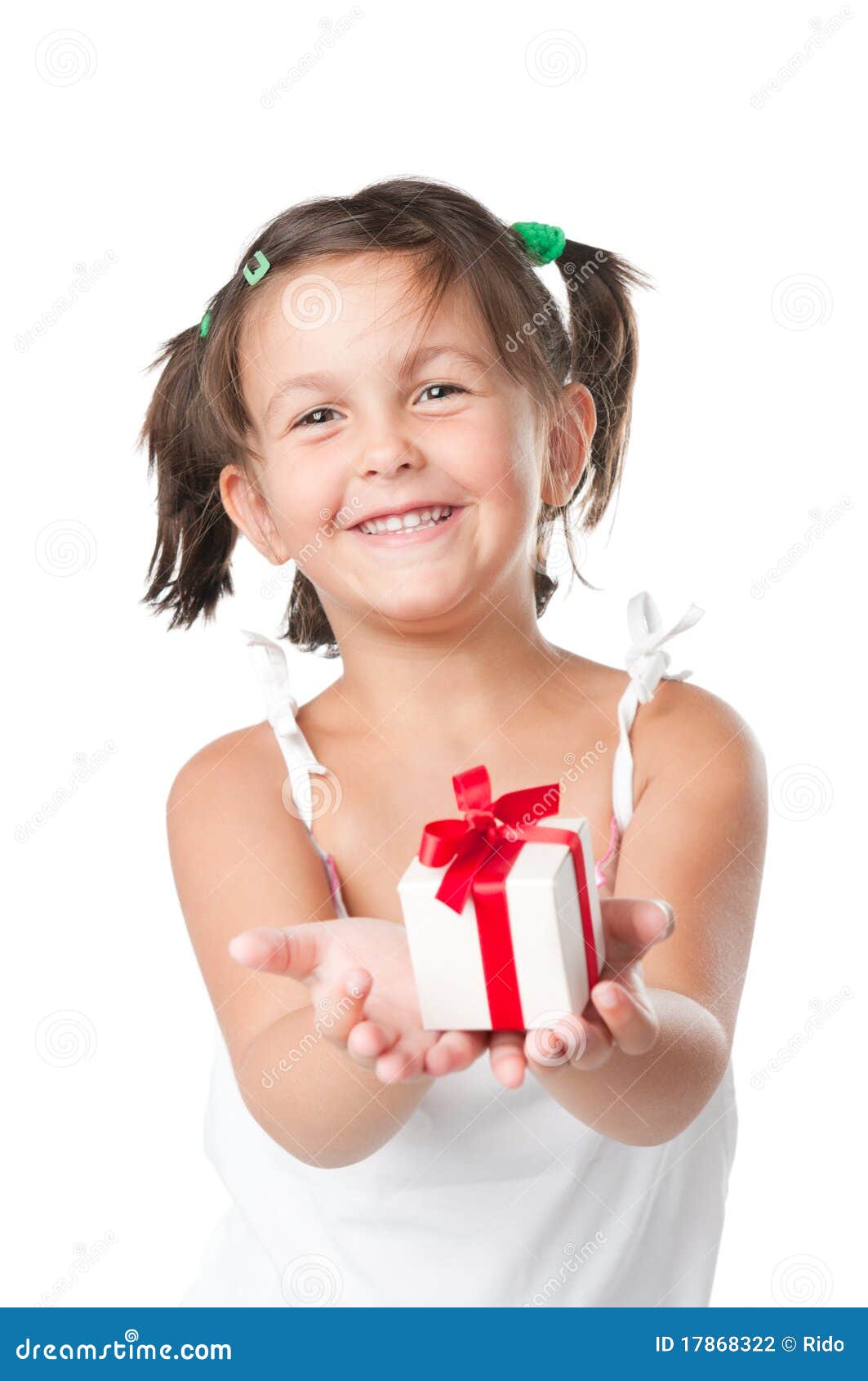 Happy girl holding a gift stock photo. Image of child - 17868322
